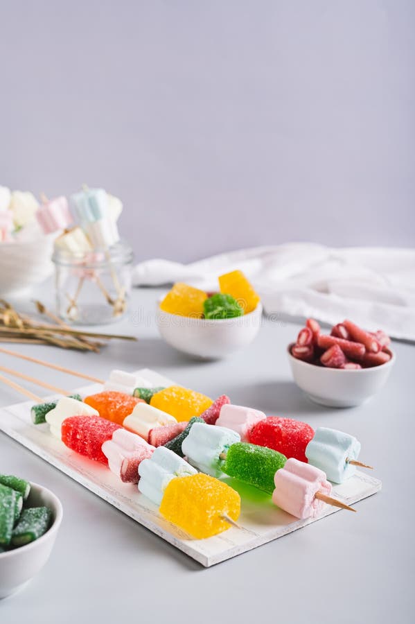 Gummy Candy Kabobs on Skewers Served on the Table Vertical View Stock ...