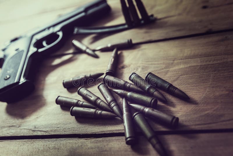 Gun and Ammunition on Wooden Table Stock Image - Image of pistol ...