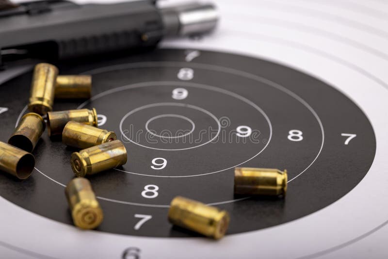 Gun and Bullets on Bull Eye Target for Shooting Practice Stock Image ...