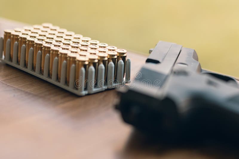 Gun with Bullets. Handgun Box with New Ammunition Stock Image - Image ...