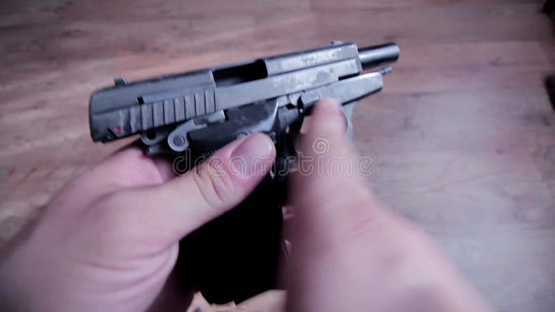 Loading a Magazine, Loading Gun, Preparing for Crime.nHandgun Magazine ...