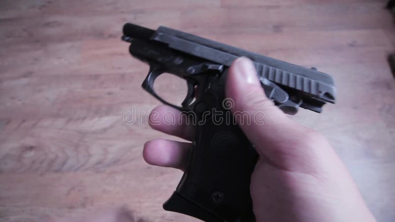 Loading a Magazine, Loading Gun, Preparing for Crime.nHandgun Magazine ...