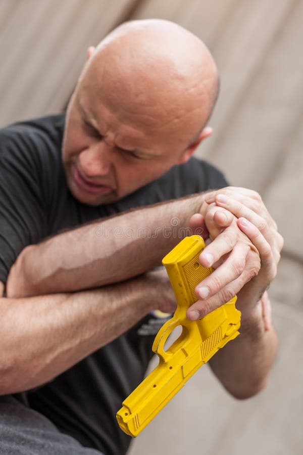 Gun Disarm. Self Defense Techniques Against a Gun Point. Stock Image ...
