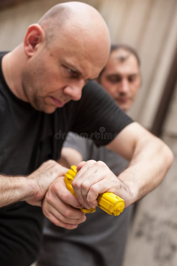 Self Defense Techniques Against Gun Stock Photos - Download 80 Royalty ...