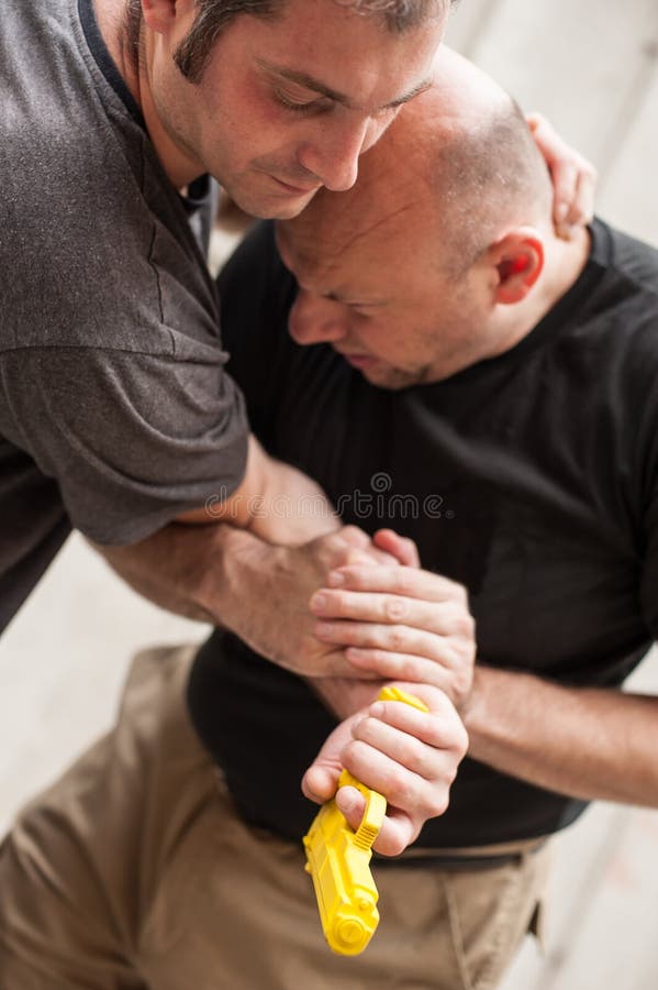 Gun Disarm. Self Defense Techniques Against a Gun Point. Stock Photo ...