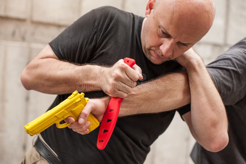 Man Aiming Handgun from Holster in Self Defense Stock Image - Image of ...