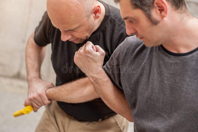Gun Disarm. Self Defense Techniques Against a Gun Point. Stock Image ...