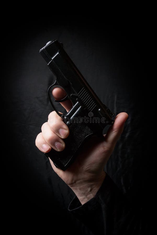 Gun in the hand of man stock photo. Image of male, caucasian - 113674370