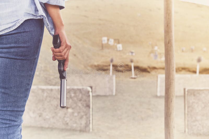Gun in the Hands of a Girl, Close-up Arms. Stock Image - Image of ...