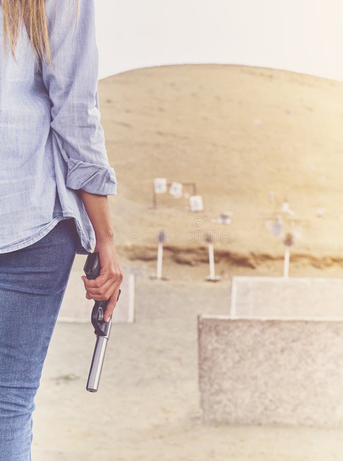 Gun in the Hands of a Girl, Close-up Arms. Stock Photo - Image of ...