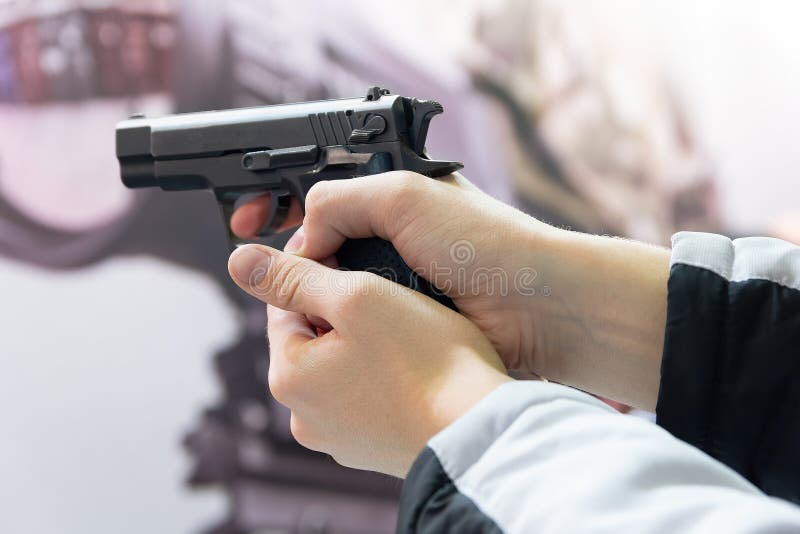 A Gun in the Hands of a Man Stock Photo - Image of load, person: 379388506