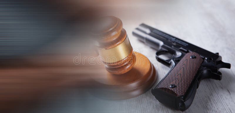 A Gun and a Judge`s Hammer on the Table Stock Photo - Image of crime ...
