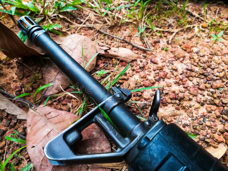 Gun of soldier on ground. stock image. Image of black - 124517295