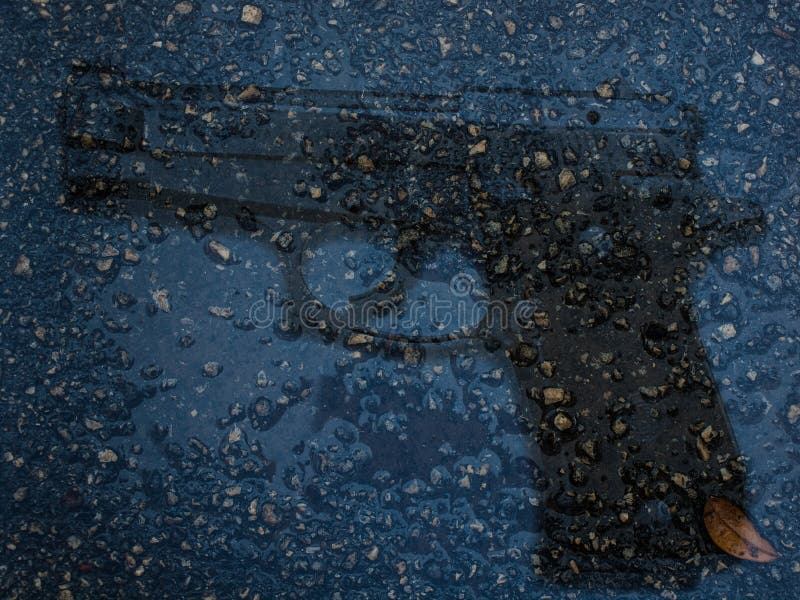 Gun in Stone stock photo. Image of hurt, cops, shoot - 64761814