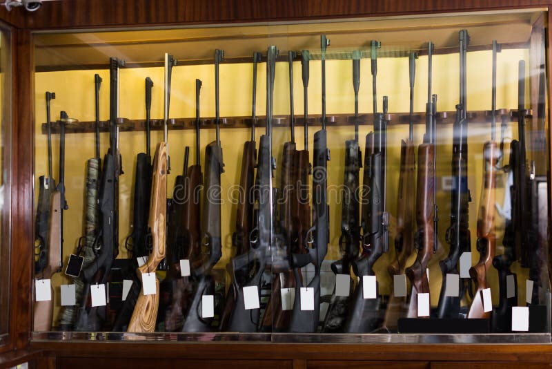 Gun Store Interior with Rifles on Showcase Stock Photo - Image of ...