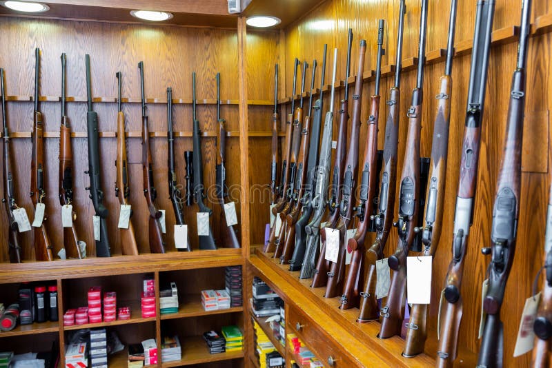 Gun Store Interior with Rifles on Showcase Stock Photo - Image of ...