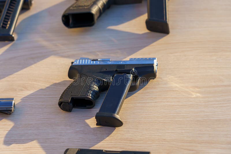 A Gun on the Table among the Weapons, Selective Focus. Crime News ...