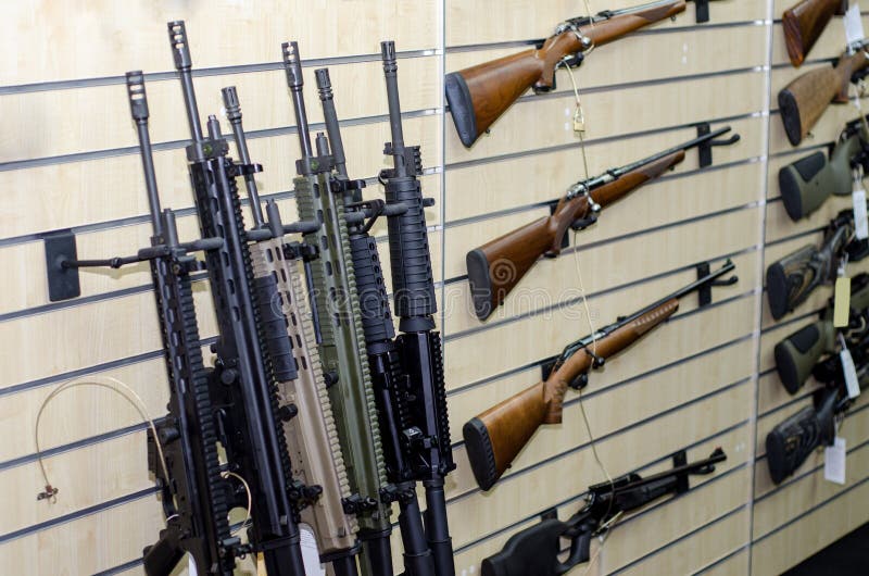 Gun wall rack with rifles stock image. Image of shop - 140870955