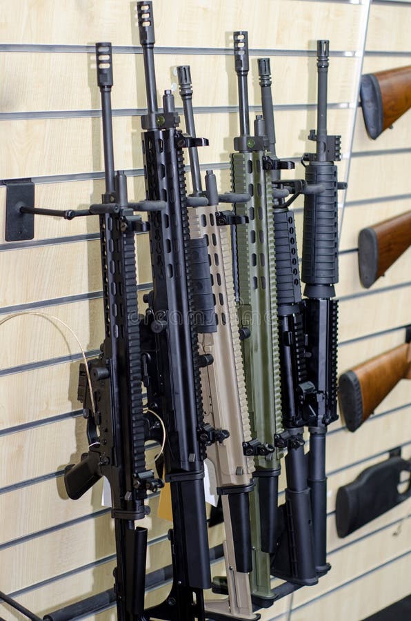 Gun wall rack with rifles stock photo. Image of sight - 140870968