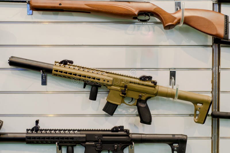 Gun wall rack with rifles stock photo. Image of selection - 141215380