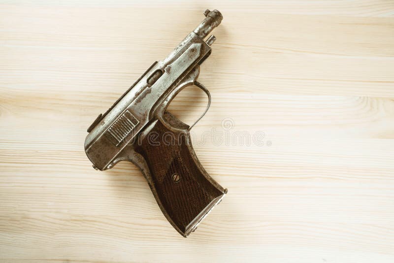 The gun is on the table stock image. Image of frame - 134892895