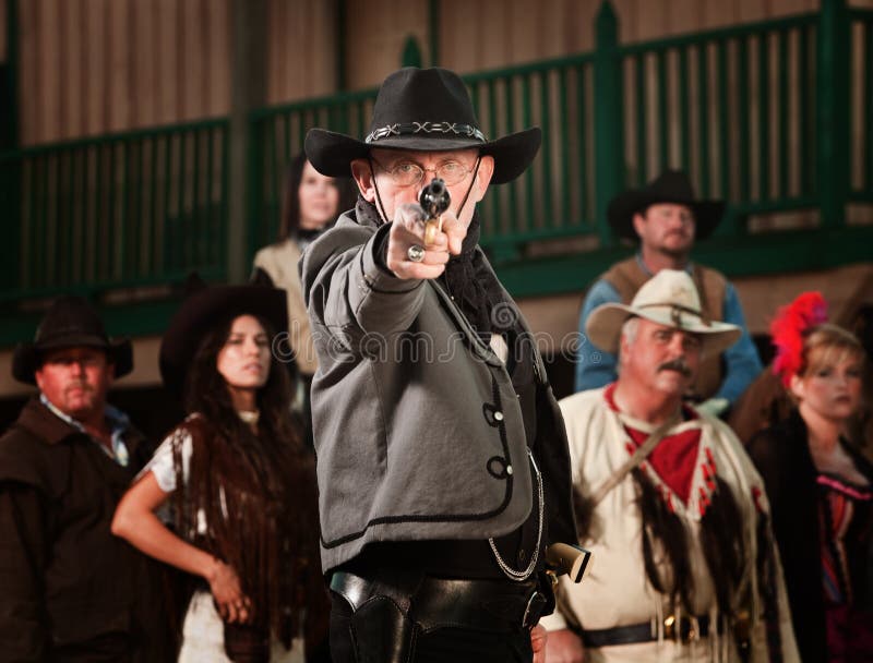 Gunfighter Points Gun at Camera Stock Photo - Image of guns, attitude ...
