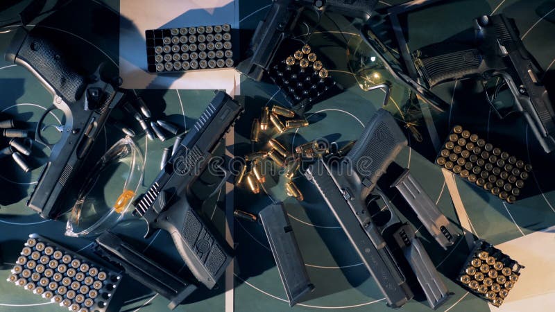Guns with Bullets on a Table at a Shooting Room. 4K Stock Footage ...