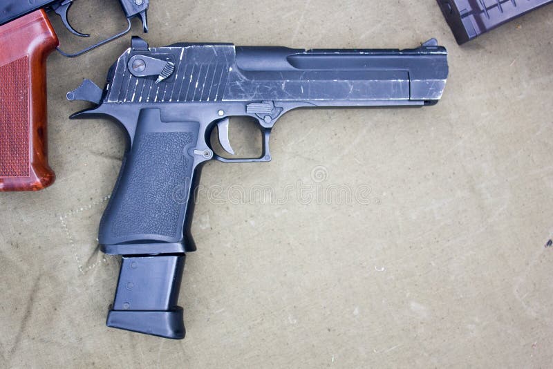 Guns on the table stock photo. Image of terrorism, weapon - 97651222