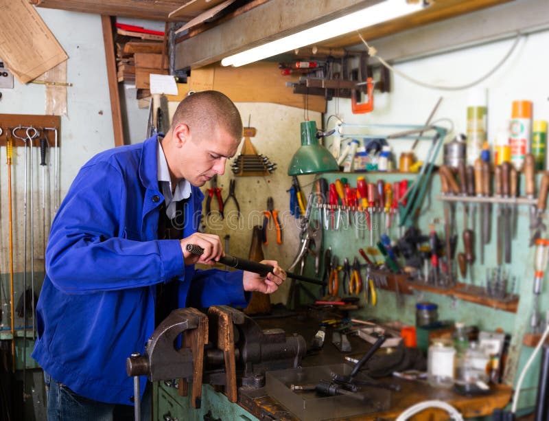 Gunsmith Assembling Shotgun after Diagnostics and Repair in Weapons ...