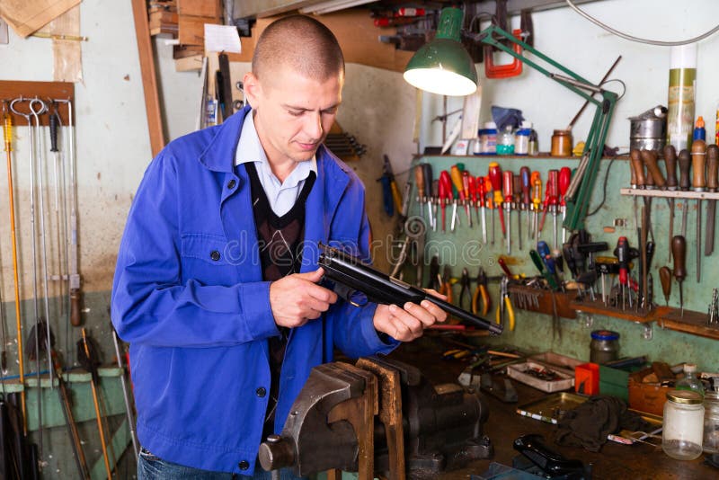 Gunsmith Assembling Smallbore Sporting Pistol in Workshop Stock Image ...