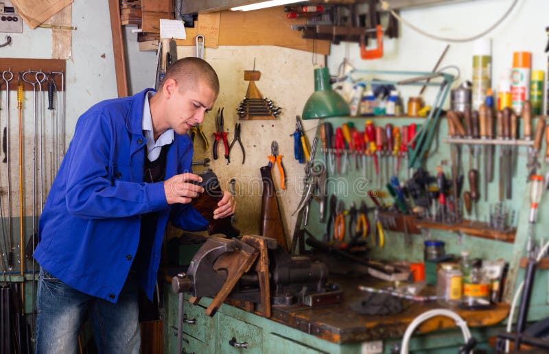 Gunsmith Repairs of a Shotgun in Weapons Workshop Stock Image - Image ...