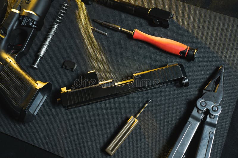 Gunsmithing, Cleaning and Repairing Weapons. Disassembled Pistol in a ...