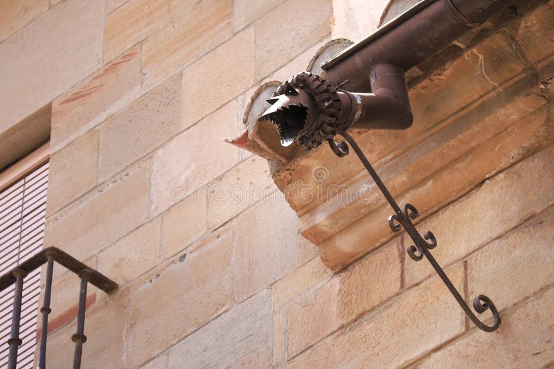 Gutter with Decorative Animal Figure Stock Photo - Image of ...