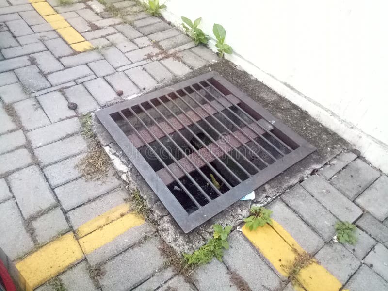 Gutter Hole with Iron Trellis Cover Stock Image - Image of house ...