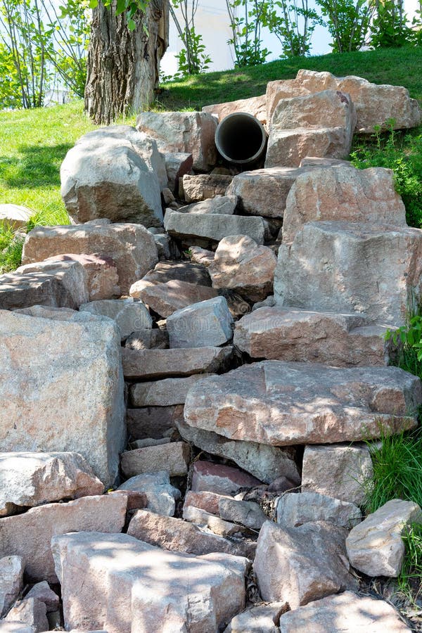 The Stone Gutter Protrudes from the Plaster Wall, it is Very Massive of ...