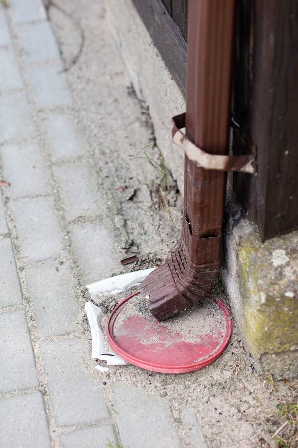 A Gutter Mounted on the Wall of the Building. Gutter Spout in Si Stock ...