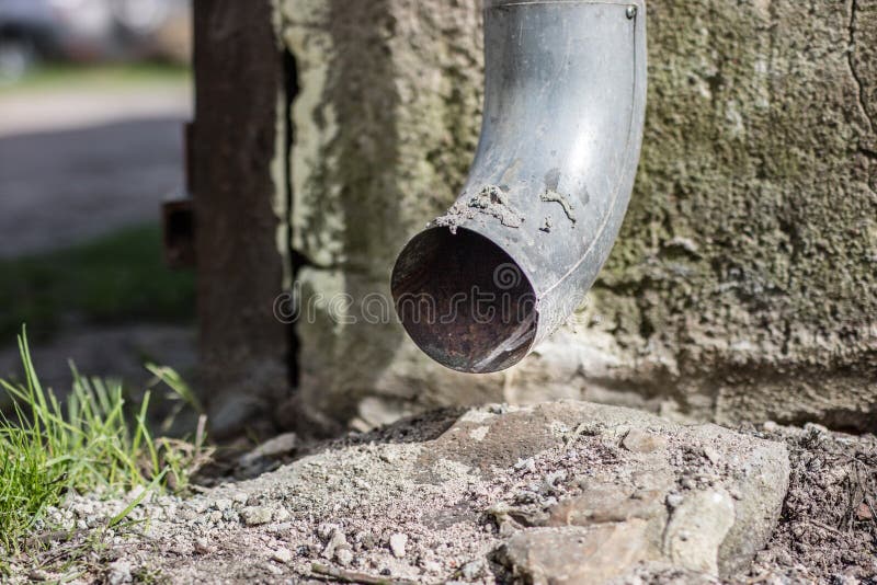 A Gutter Mounted on the Wall of the Building. Gutter Spout in Si Stock ...
