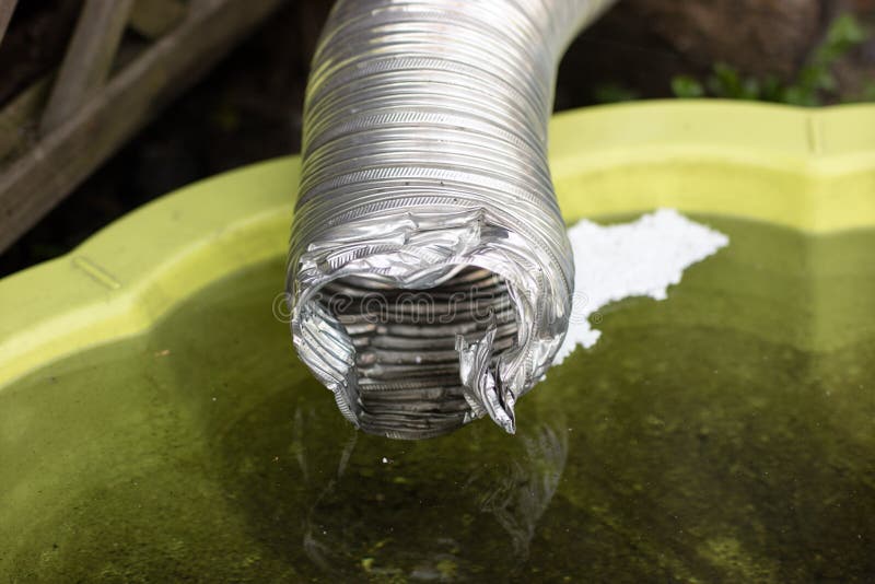 A Gutter Mounted on the Wall of the Building. Gutter Spout in Si Stock ...