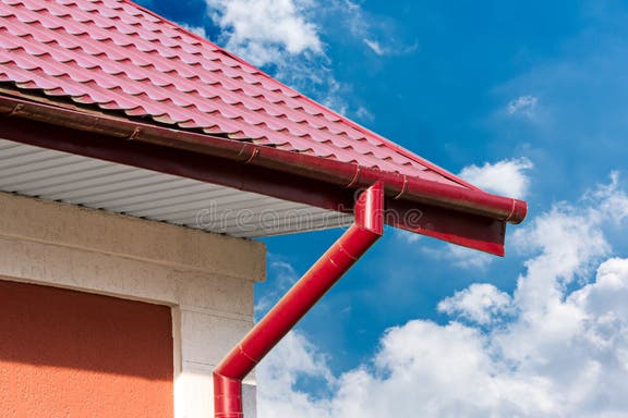 Gutter and red tiled roof stock image. Image of blue - 43364793