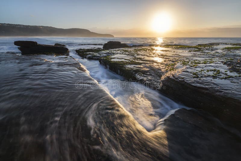 Gutter in the Rocks at Sunrise on the Beach Stock Photo - Image of land ...