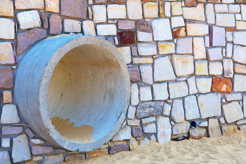 Gutter in a Stone Wall on the Beach Stock Photo - Image of concrete ...