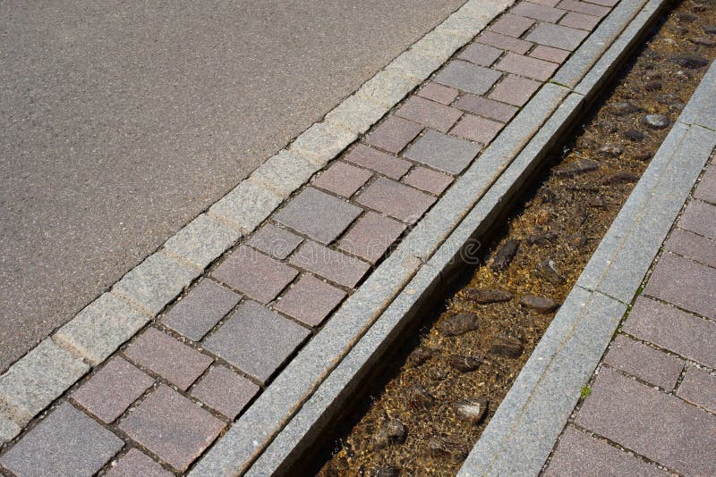 Gutter of Stone with Water between Sidewalk and Road Stock Photo ...