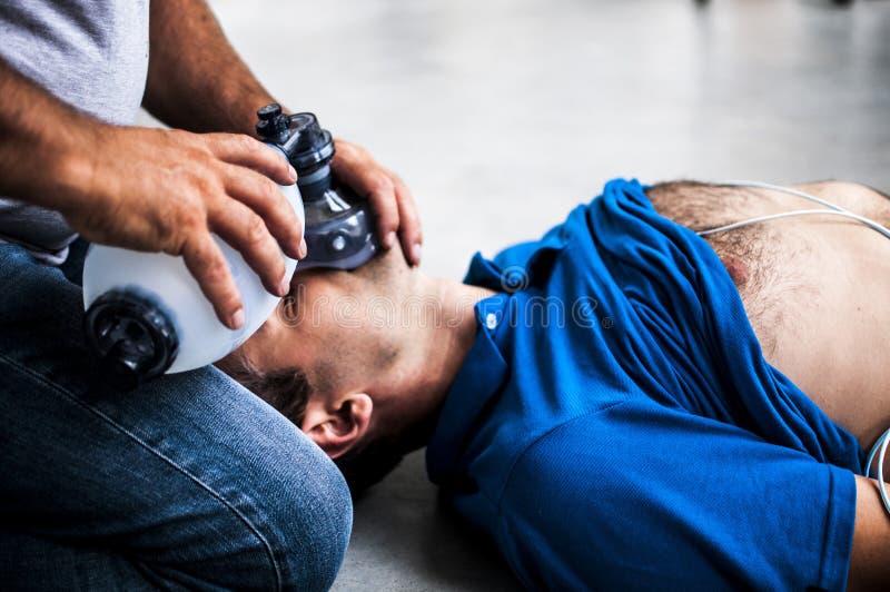 Guy Assisting an Unconscious Man Stock Image - Image of fatal, cardiac ...