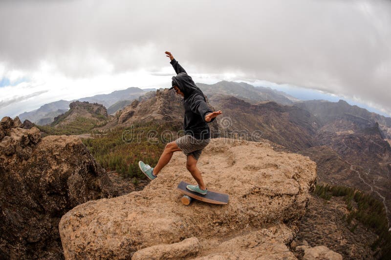 Guy with Balance Board Near the Cliff Stock Photo - Image of sports ...
