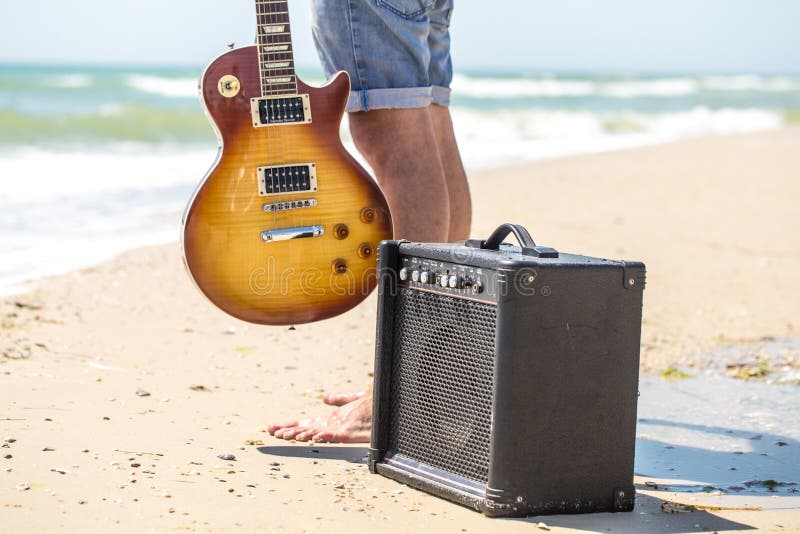 The Guy on the Beach with Musical Instruments Stock Photo - Image of ...