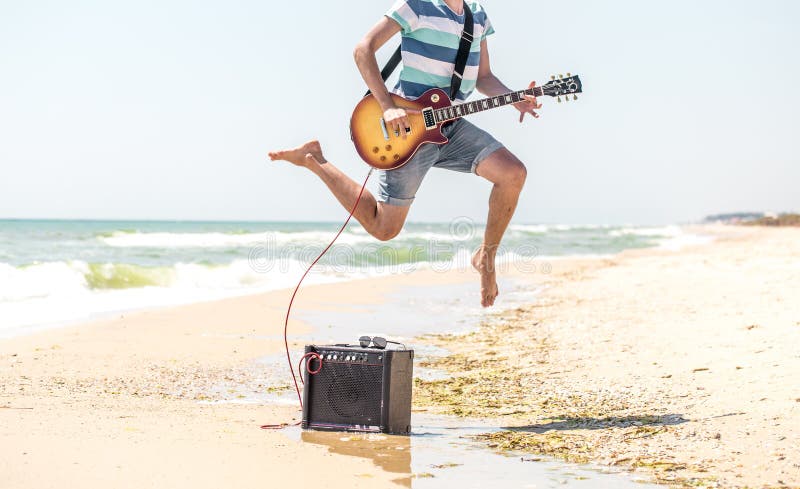 The Guy on the Beach with Musical Instruments Stock Photo - Image of ...