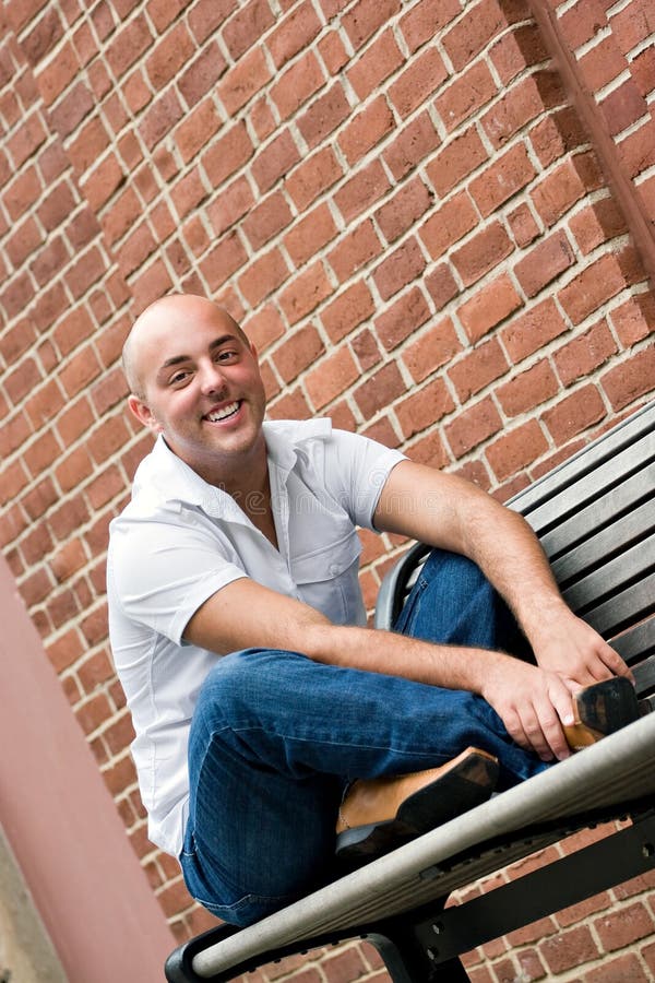 Guy on a Bench stock image. Image of happy, bench, posing - 12210431