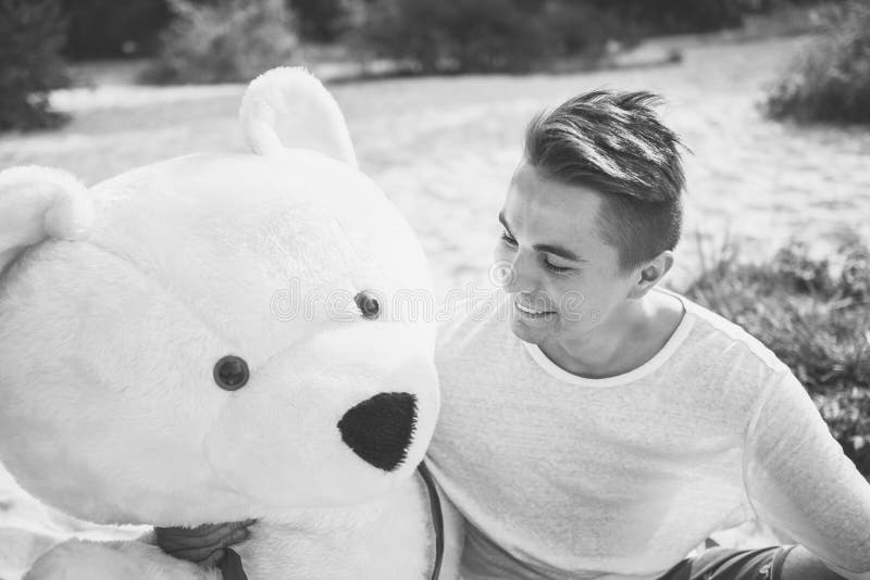 Guy with a big teddy bear stock image. Image of cheerful - 58000373
