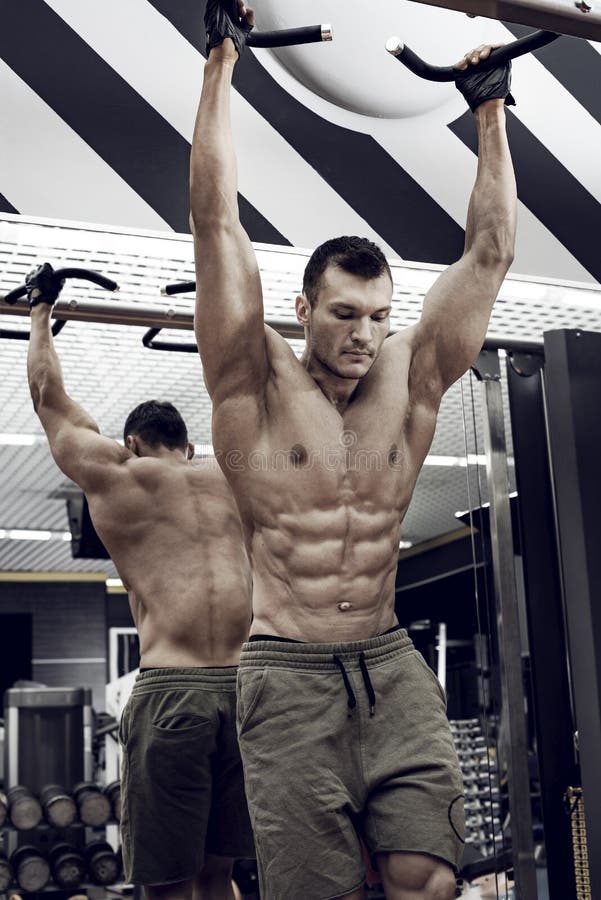 Guy Bodybuilder Do Chin-ups Stock Photo - Image of indoor, exercises ...