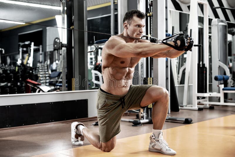 Guy Bodybuilder with Exercise Machine Stock Image - Image of physical ...